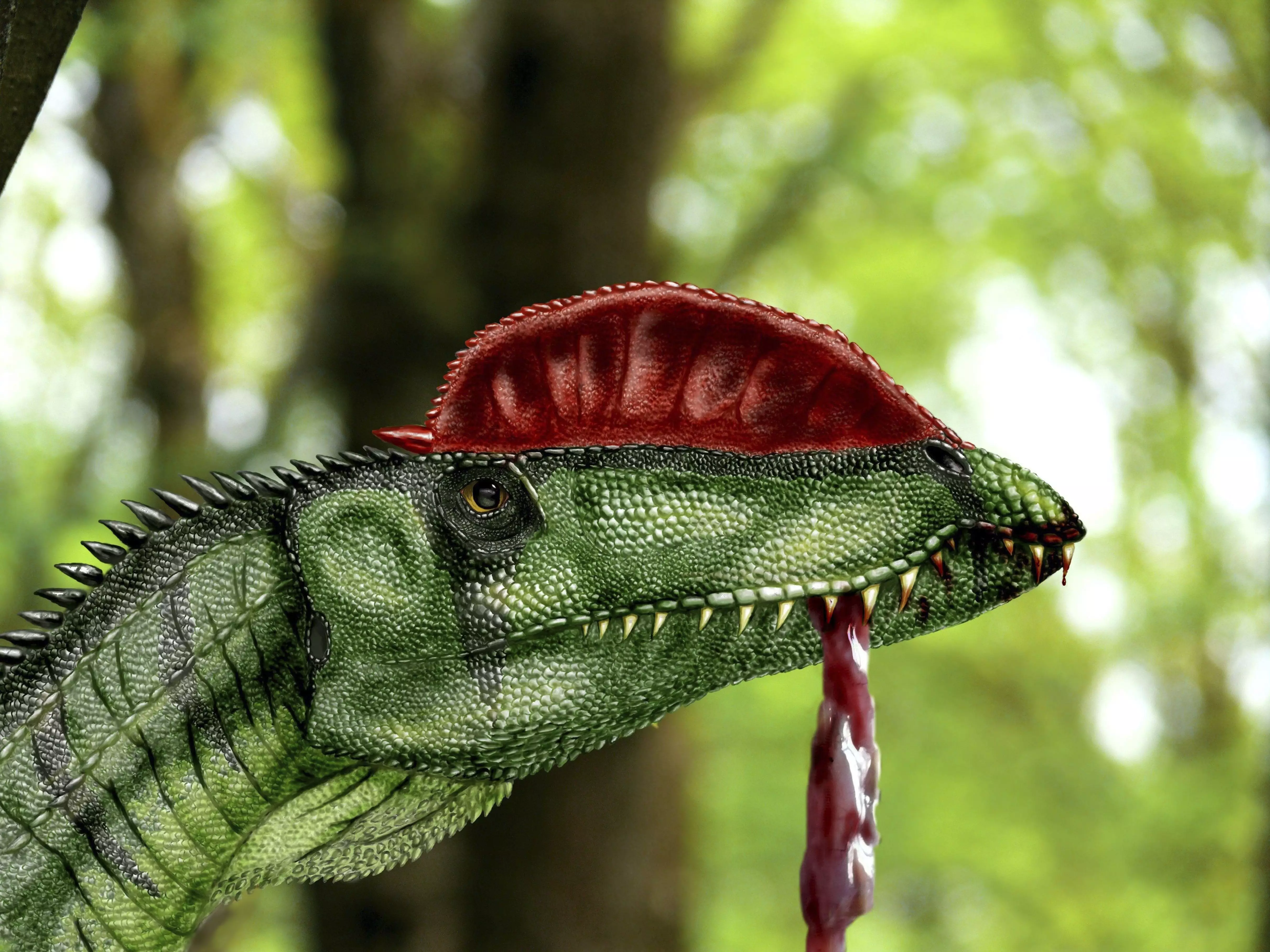Dilophosaurus met stukkie vleis in sy mond