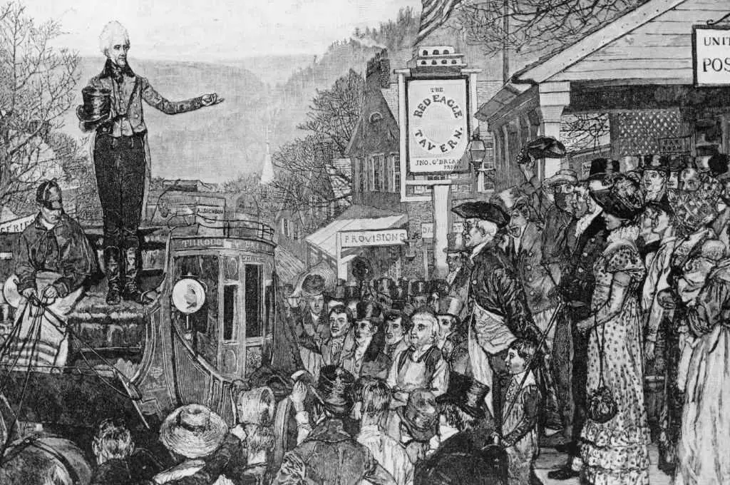 安德魯杰克遜站在馬車上向支持者揮手致意，在前往華盛頓的途中，於 1829 年成為美國第七任總統。