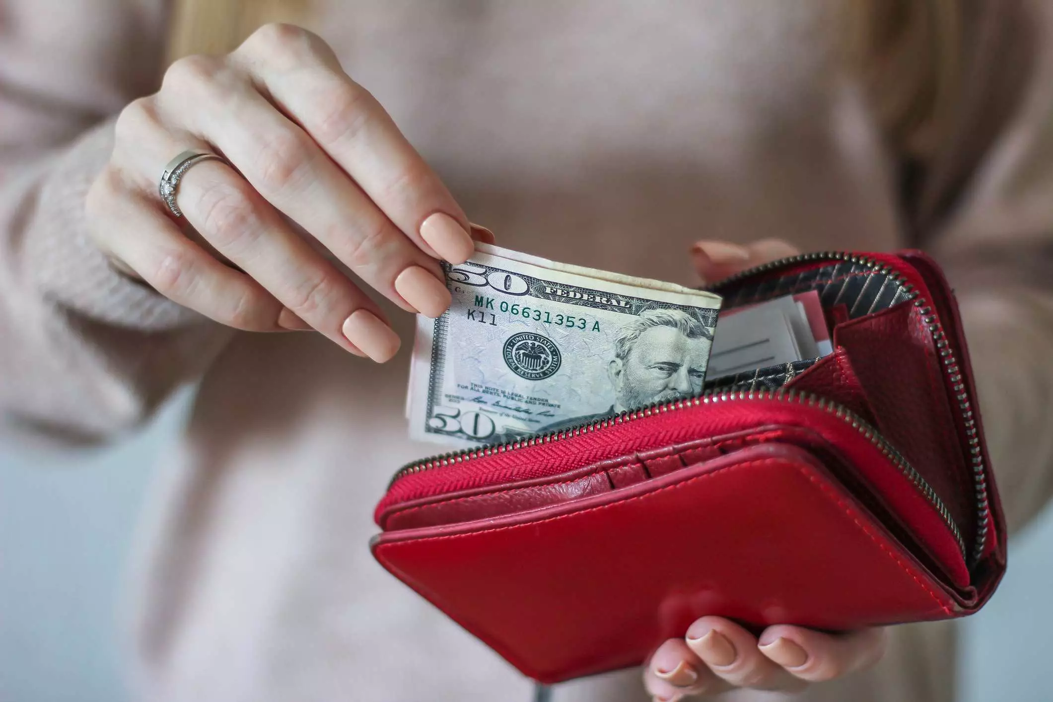 Midsection Of Woman Holding Purse